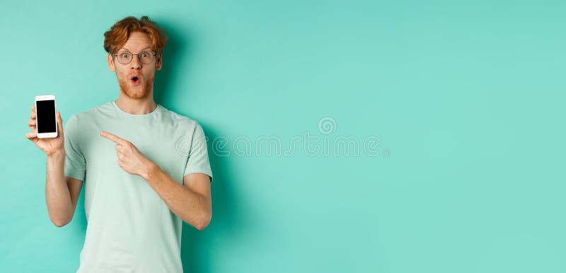 Check This Out Handsome Redhead Guy In Glasses Pointing Finger At