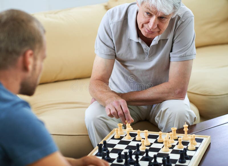 Check Out this Masterful Move. a Father and Son Playing a Game of Chess ...