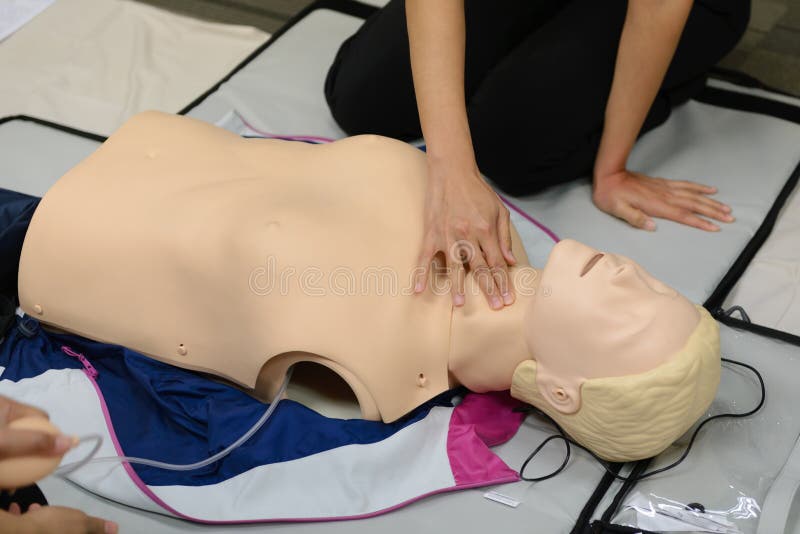 Check Pulse - CPR First Aid Training with CPR Dummy in the Class Stock Image - Image of help ...