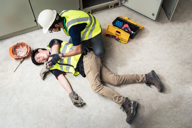 Accident in Industrial Work with First Aid Stock Image - Image of ...