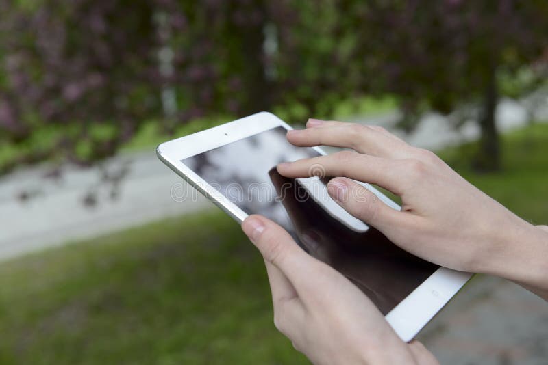 Check the Tablet during Walking on the Street Side Look Editorial ...