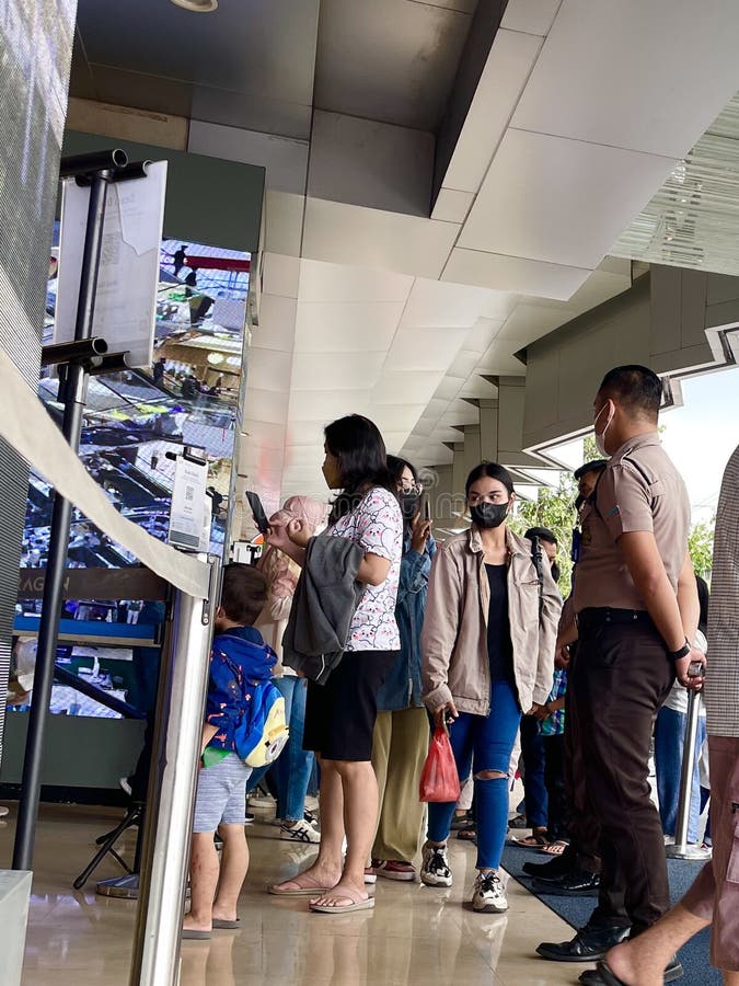 Check in to enter the mall editorial stock image. Image of guard ...