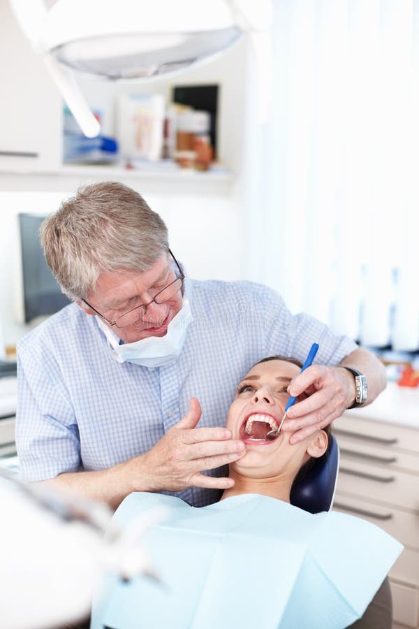 Check Up Visit. Portrait of Male Dentist Checking Patients Teeth. Stock ...
