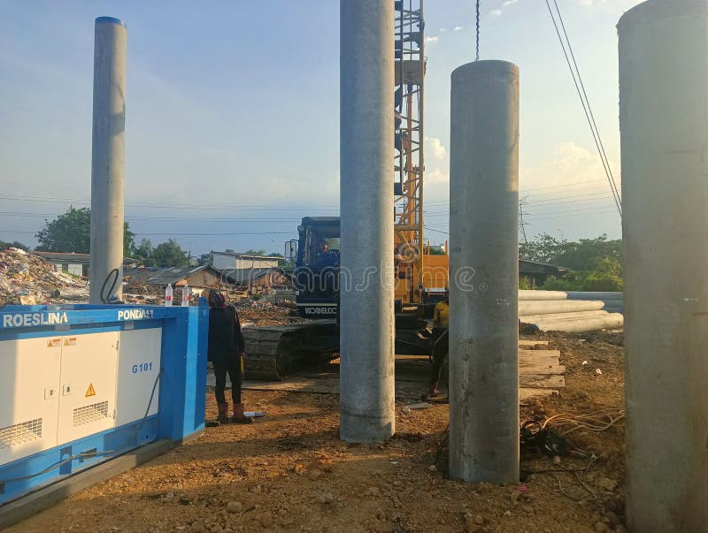 Check verticality of pile editorial photo. Image of asphalt - 262684921