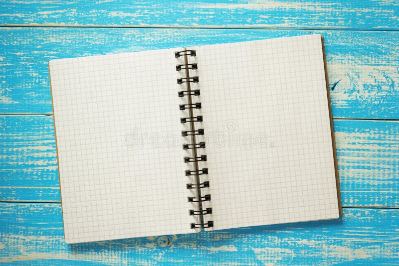 Checked notebook on wood stock photo. Image of book, notepad - 84425048