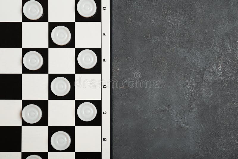Checkerboard with Game Pieces on Grey Table, Top View. Space for Text ...