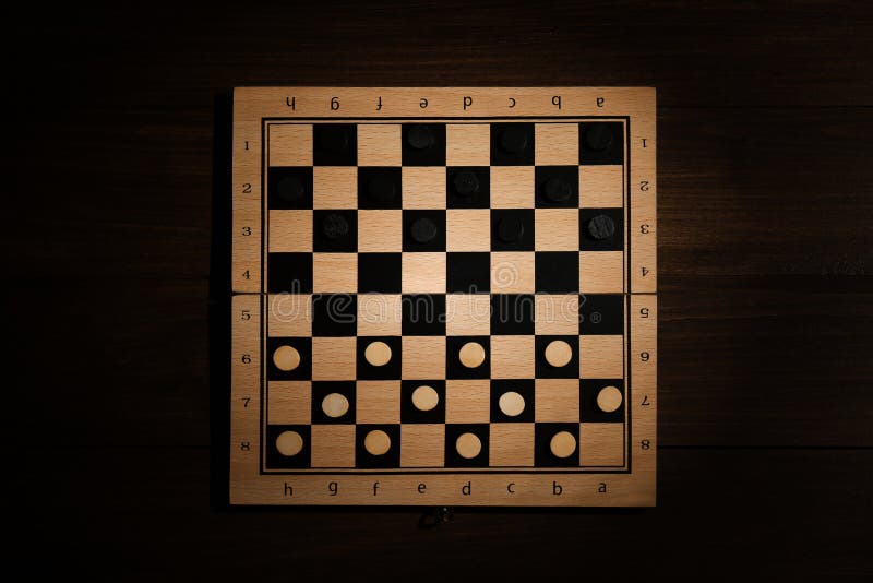 Checkerboard with Game Pieces on Wooden Table, Top View Stock Photo ...