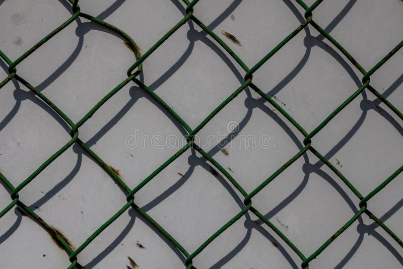 Checkered Green Rusty Bars from the Fence Stock Image - Image of ...