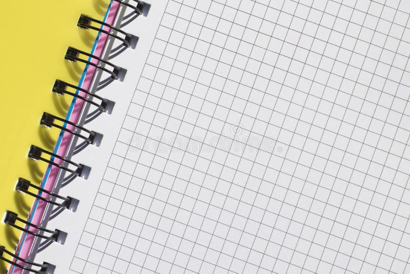 Checkered Notepad with Yellow Cover Close Up. Stock Image - Image of ...