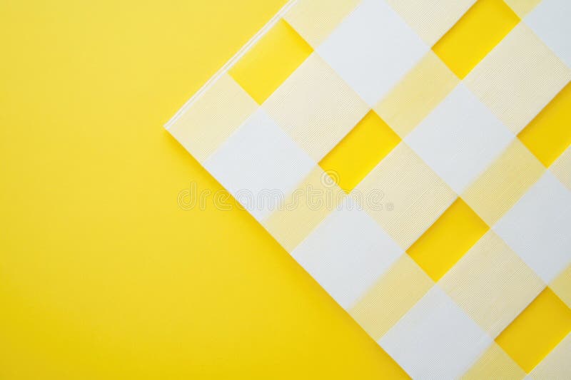 A Checkered Paper on a Bright Yellow Background, Ready for Use in ...