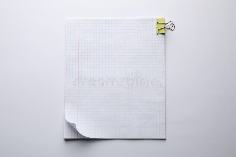 Checkered Paper Sheets with Binder Clip on White Background, Top View ...