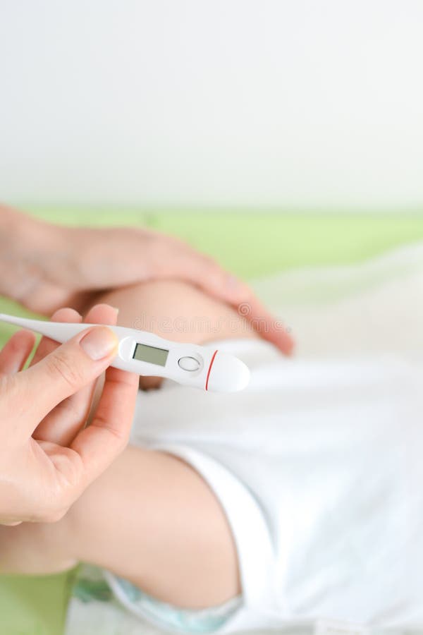Checking baby temperature stock image. Image of newborn - 80913915
