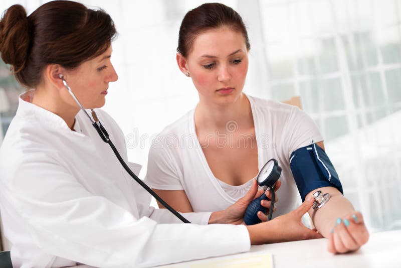 Checking blood pressure stock photo. Image of patient - 26256954