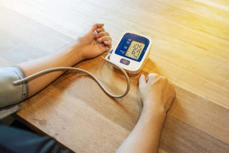Checking the Blood Pressure with a Modern Digital Equipment Stock Image ...