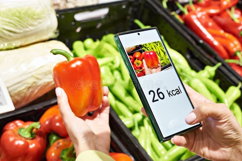 Checking Calories on Red Bell Pepper Vegetable in Store with Smartphone ...