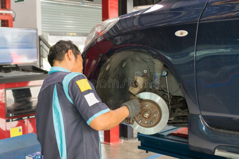Checking car brake system editorial photography. Image of maintenance ...