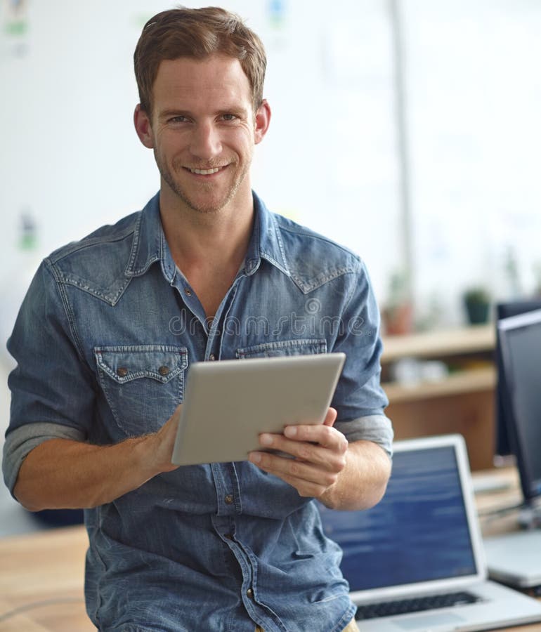Checking the Days Schedule Online. a Young Man Holdig a Digital Tablet ...