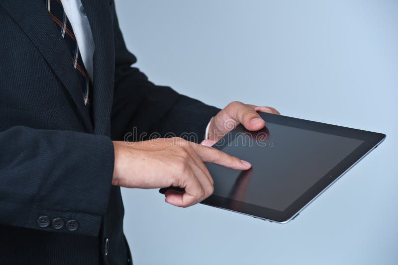 Checking on digital tablet stock photo. Image of laptop - 27045916