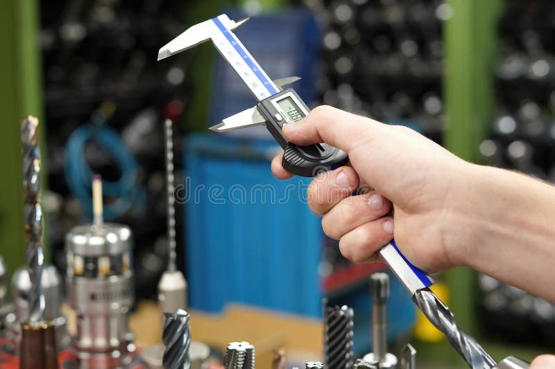 Checking the Dimensions of the Cutting Tool with a Caliper for ...