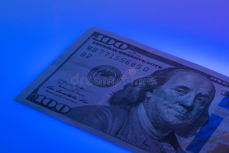 Checking 100 Dollar Banknote with Ultraviolet Lamp. Examining Hundred ...