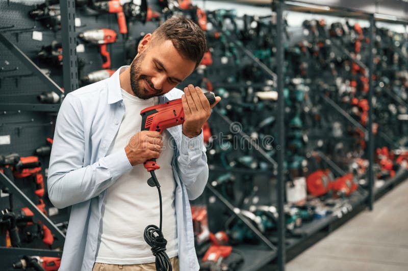 Checking the Drill. Man is in the Hardware Shop Stock Illustration ...