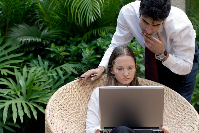 Checking Each Other s Work stock image. Image of team - 4688079