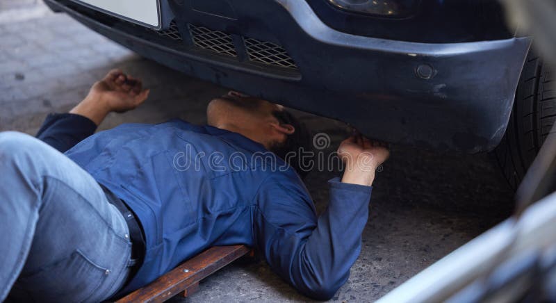 Checking Every Inch of Your Car. High Angle Shot of a Handsome Young ...