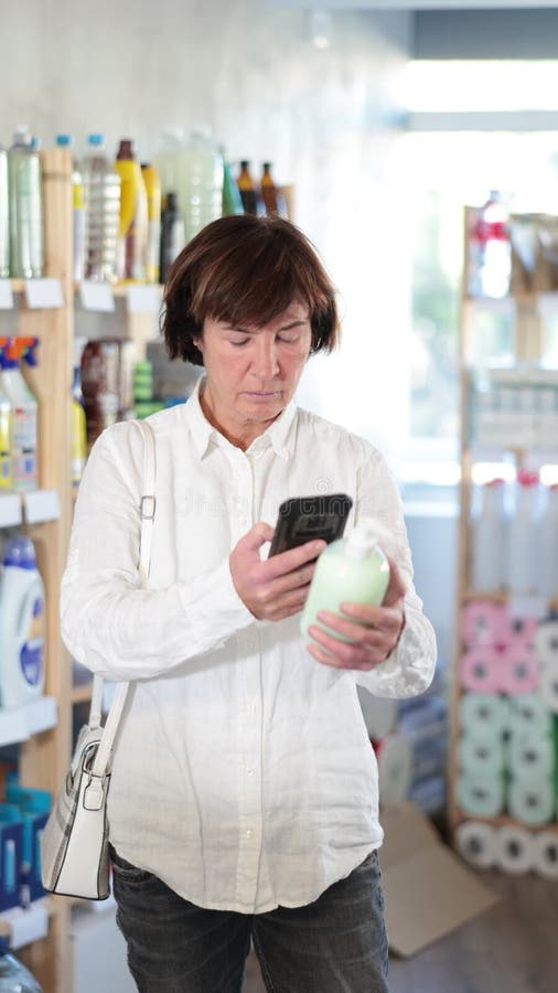 Checking Expiration Date of Liquid Hand Soap - Female Shopper Scans QR ...