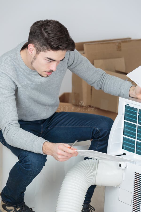 Checking the filter first stock photo. Image of worker - 196366566