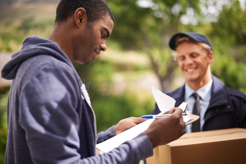 Checking the Fine Print. a Handsome Young Man Signing a Form for a ...