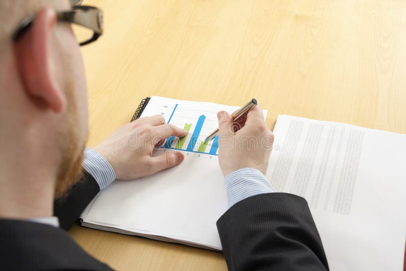 Checking Graphs and Data stock image. Image of figure - 31488305