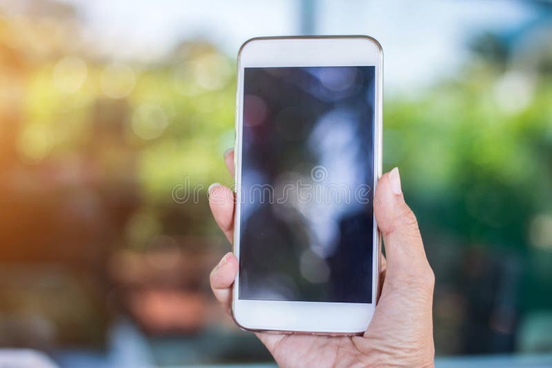 Businesswoman Sending Message with Smartphone in Office Stock Photo ...