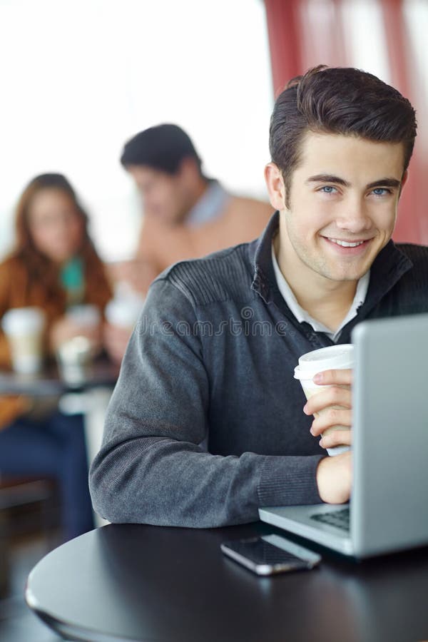 Checking His Emails on the Go. a Handsome Young Man Using His Laptop in ...