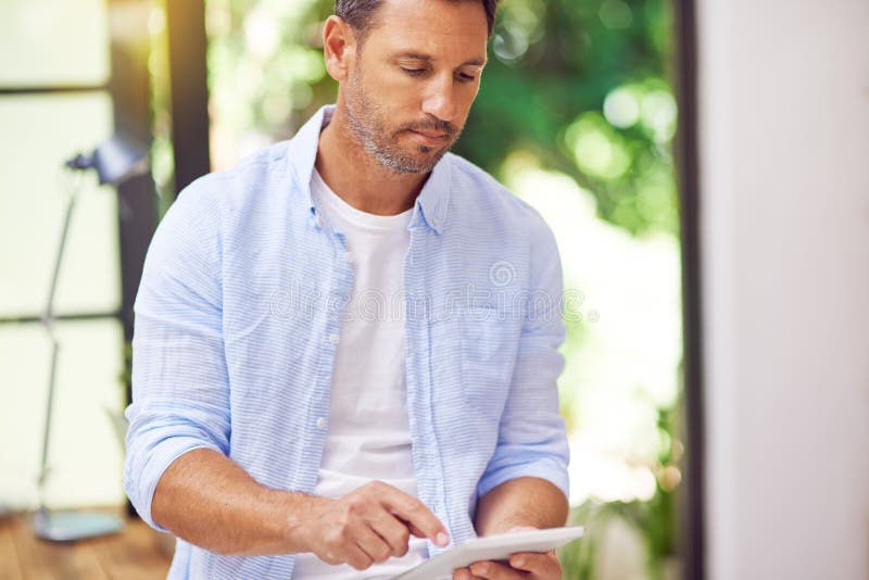 Checking His Emails on the Go. a Young Man Working from Home. Stock ...