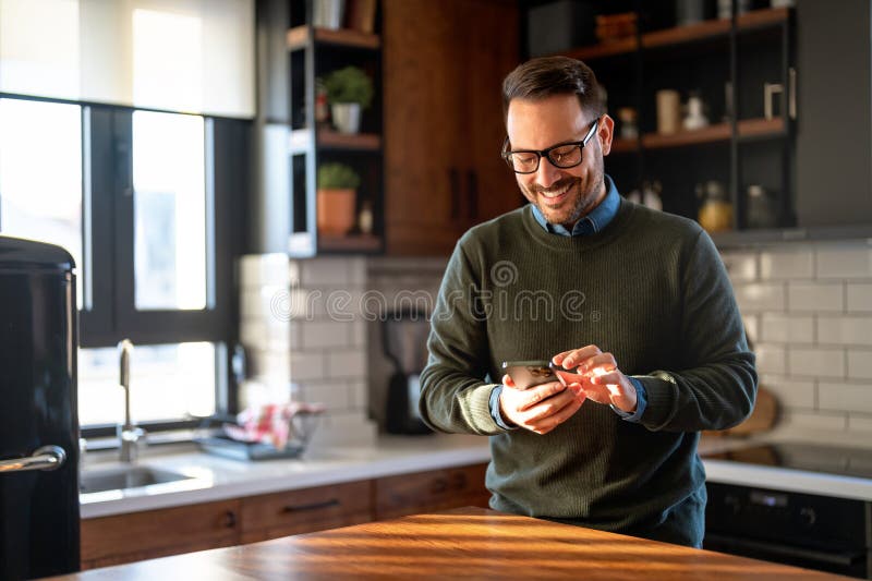 Checking His Messages Over Coffee. Man Using a Smart Phone while ...