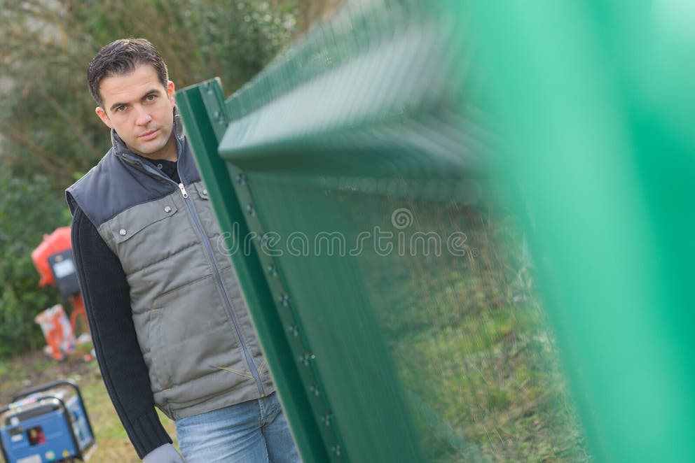 Checking If the Fence is Straight Stock Image - Image of fence ...