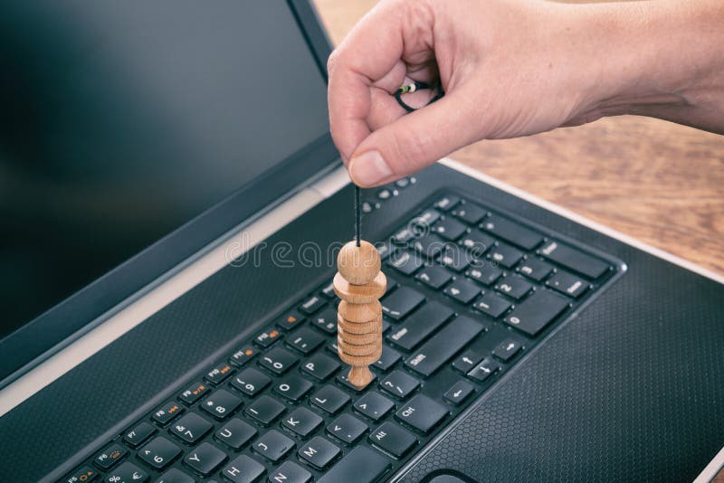 Checking Laptop with Pendulum Stock Photo - Image of concepts, future ...