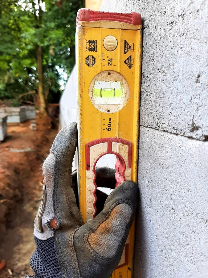Checking Level of the Wall with the Level Tool Stock Photo - Image of ...