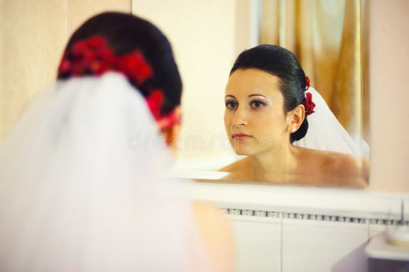 Checking makeup in mirror stock image. Image of wedding - 23406345