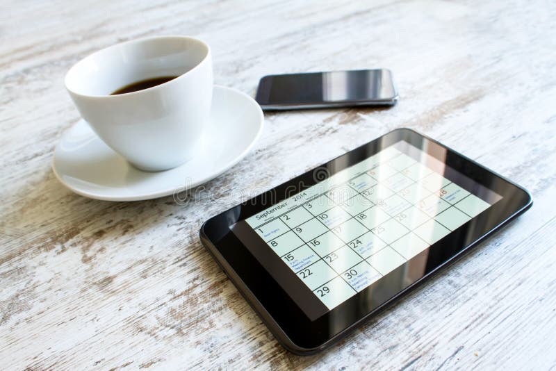 Checking Monthly Activities in the Calendar in the Tablet Stock Photo ...