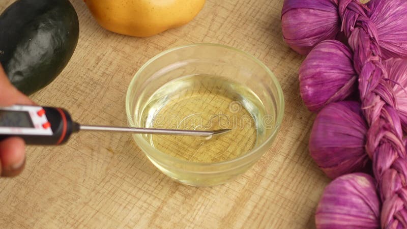 Checking Oil Temperature for Cooking Stock Video - Video of domestic ...