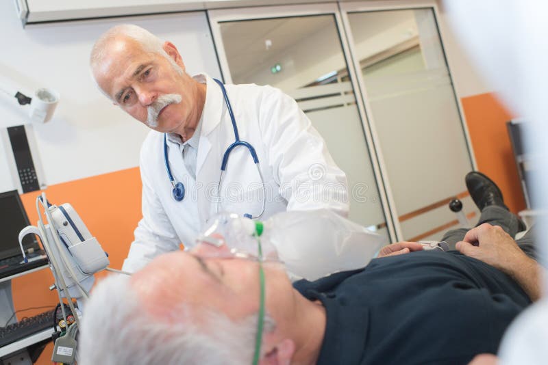Checking Patient Wearing Oxygen Mask Stock Photo - Image of hospital ...