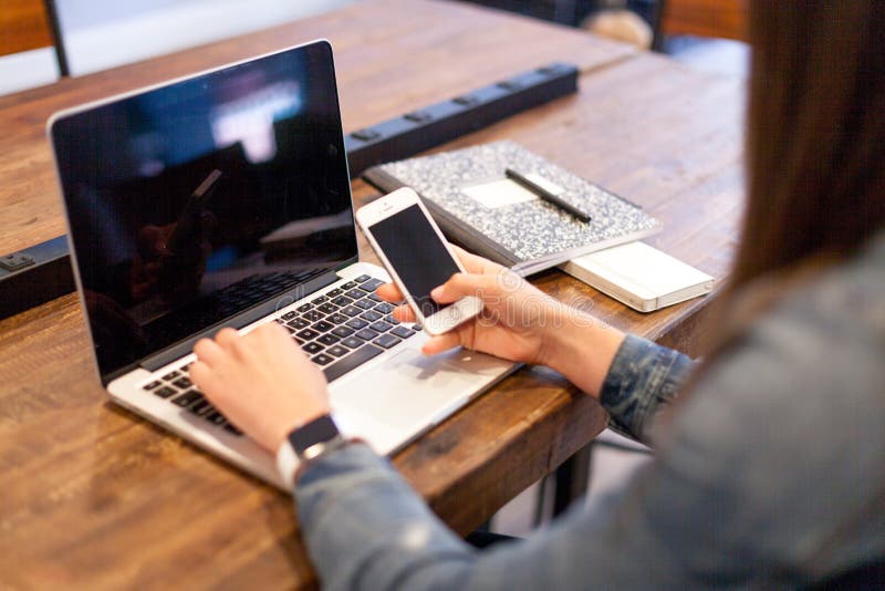 Checking phone stock image. Image of laptop, occupation - 73990761