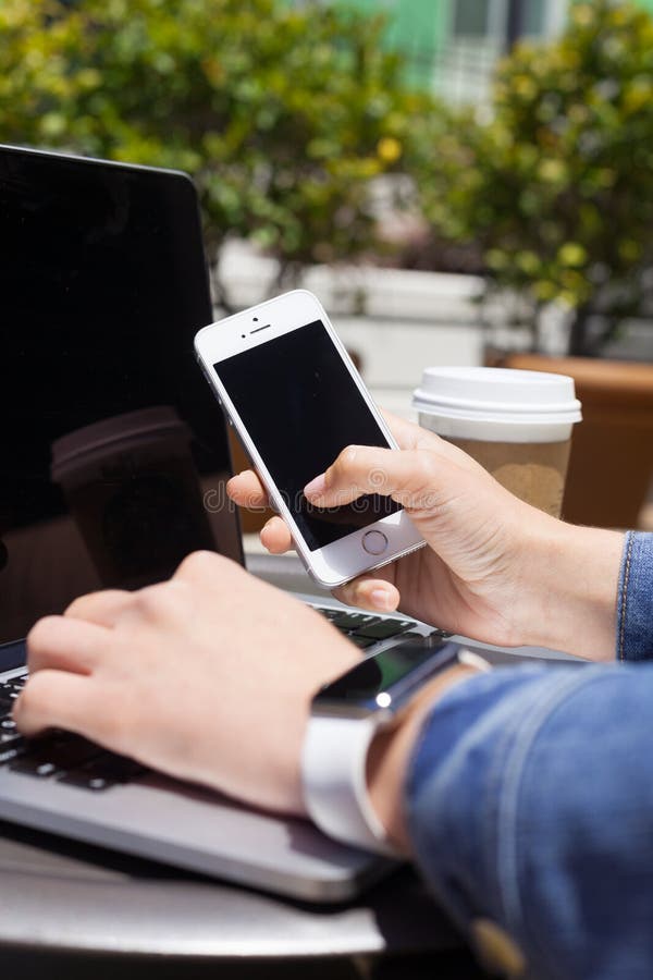 Checking phone stock photo. Image of coffee, electronic - 73990862