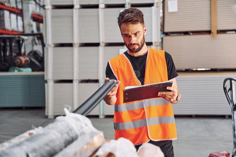 Checking Quality of Product. Storage Worker is in the Warehouse Stock ...