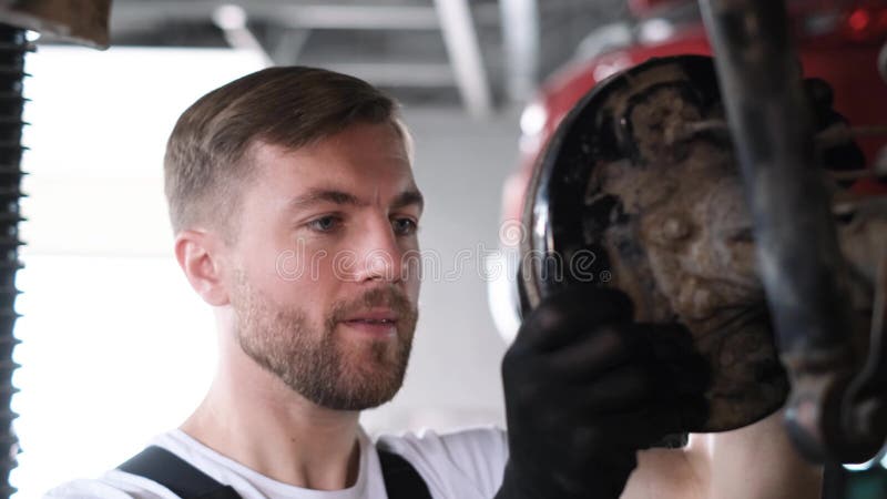 A Man Checks the Technical Condition of a Car Stock Image - Image of ...