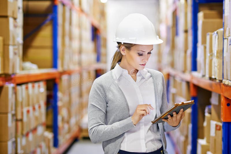 Checking the Shipments Status. a Woman at Work in a Storage Warehouse ...