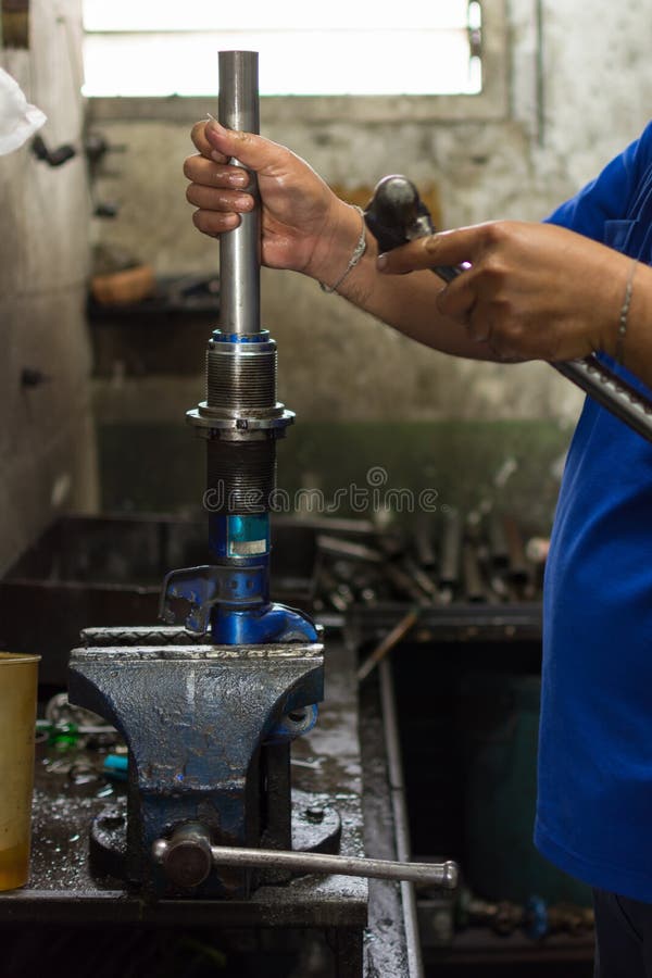 Checking Shock Absorber in Car Suspension Stock Photo - Image of ...