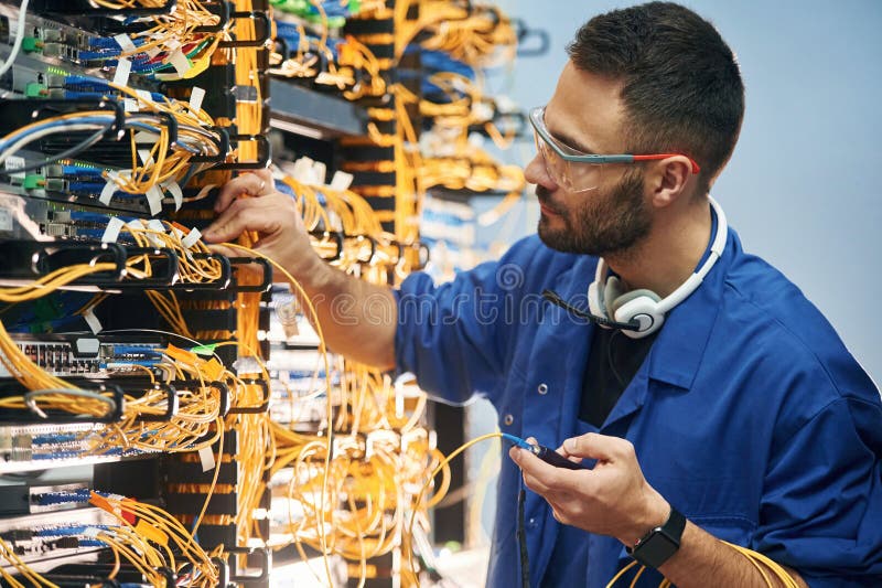 Checking Signal by Device. Young Man is Working with Internet Equipment ...