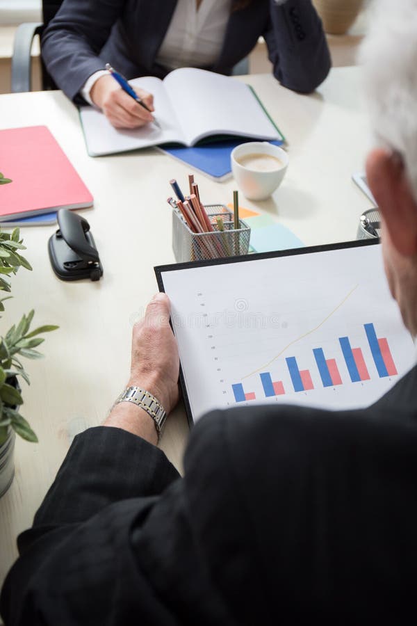 Checking the statistics stock image. Image of businesspeople - 54279995